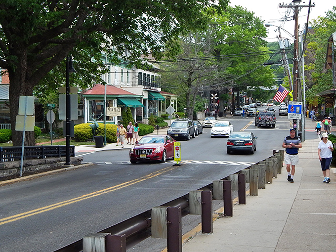 Bridge Street buzzes with small-town charm while the colorful "Lambertville" banner welcomes visitors to this riverside gem.