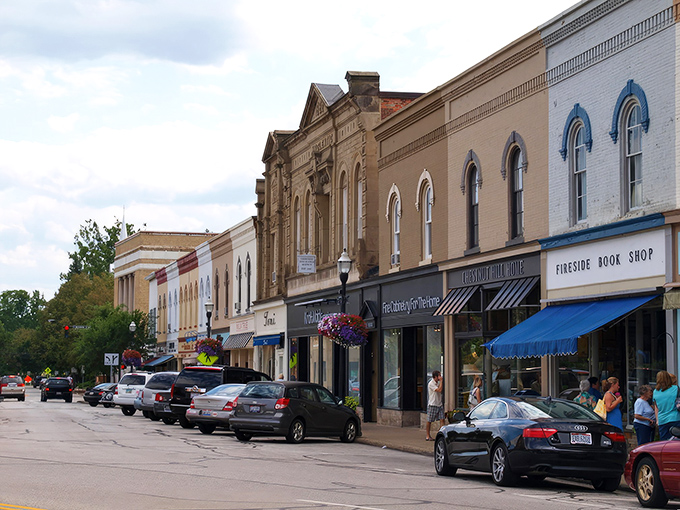 Brick facades and colorful awnings line Main Street, where small-town charm meets architectural character in a scene straight from a Hallmark movie.
