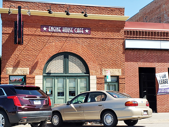 The iconic brick facade of Engine House Cafe stands as a delicious monument to adaptive reuse. Those green doors once welcomed fire trucks; now they usher in hungry Nebraskans.
