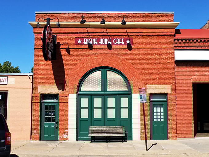 The iconic brick facade of Engine House Cafe stands as a delicious monument to adaptive reuse. Those green doors once welcomed fire trucks; now they usher in hungry Nebraskans.