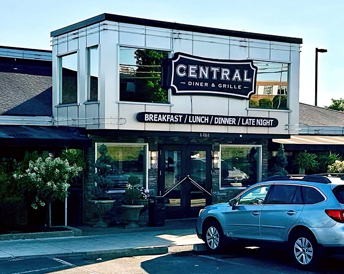 The modern diner facade gleams like a beacon of comfort food promise. Pittsburgh's Central Diner & Grille stands ready to welcome hungry souls day or night.
