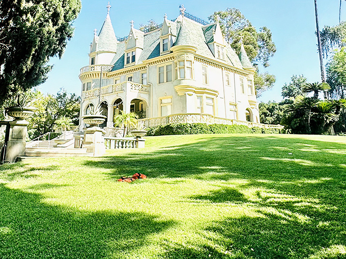 The blue-green mansard roof of Kimberly Crest rises like a Victorian dream against the California sky, proving fairytales aren't just for storybooks.