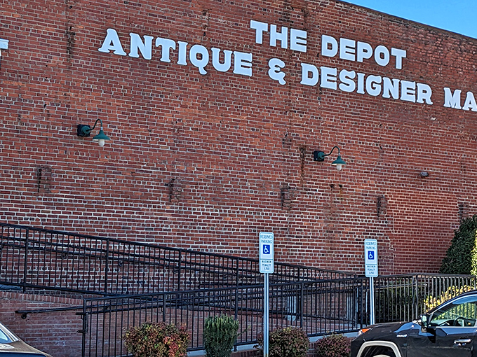 The iconic brick exterior of Gibson Mill stands proud against Carolina blue skies, a former textile factory now housing treasures waiting to be discovered. 