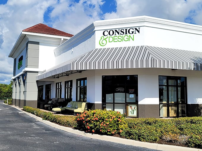 The white stucco exterior with its distinctive striped awnings might not scream "treasure trove," but inside awaits a wonderland of secondhand luxury.