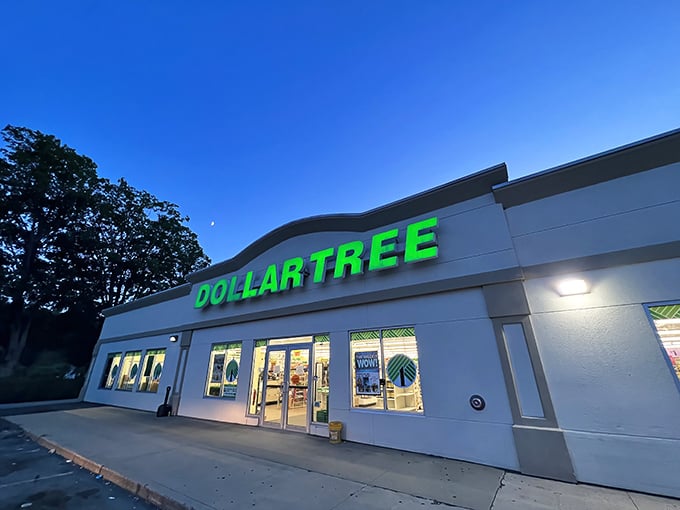 The iconic green glow of Dollar Tree's sign beckons bargain hunters like a budget-friendly lighthouse on the shores of Somersworth.