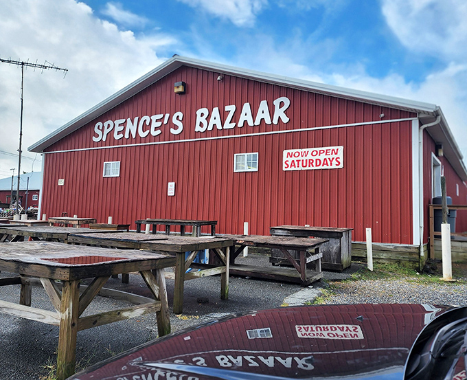 The iconic red barn of Spence's Bazaar stands like a treasure chest waiting to be opened, promising discoveries that'll make your weekend complete.
