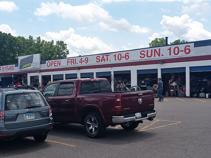 The weathered facade of Dixieland proudly announces "OPEN FOR OVER 50 YEARS!" like a badge of honor in a world of here-today-gone-tomorrow retail.