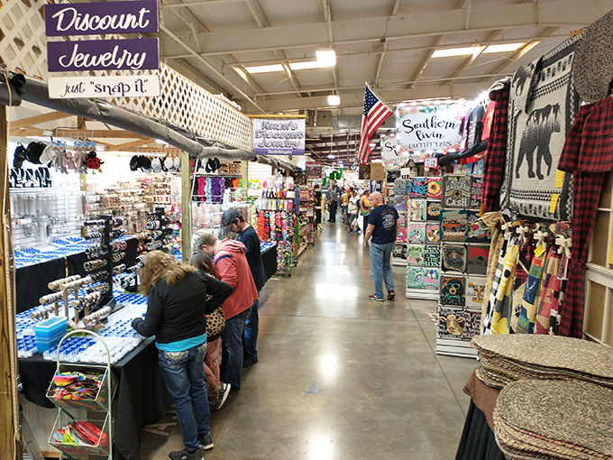 The outdoor vendor area buzzes with weekend warriors hunting treasures under Tennessee's blue skies. Every table holds someone's future conversation piece.