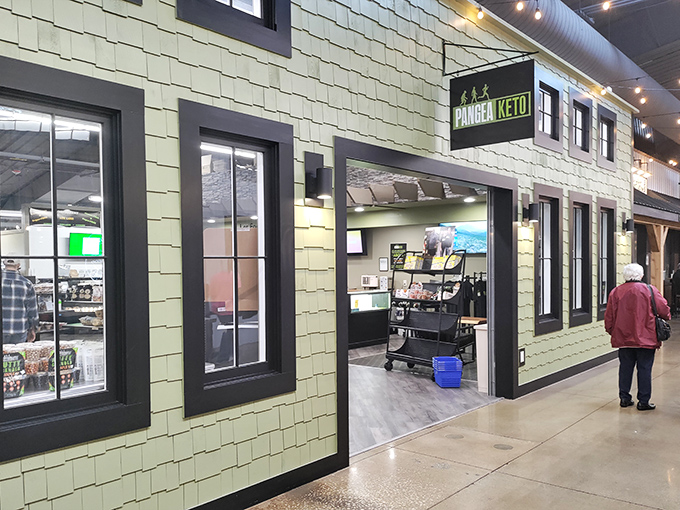 Step into a world where shopping feels like exploring a small town. The mint-green exterior of Pangea Keto is just one storefront in this vast indoor treasure hunt.