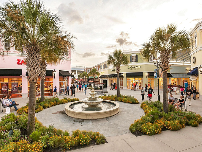 Palm trees frame the Charleston-inspired architecture of Tanger Outlets, where fountains and storefronts create a shopping oasis that feels more resort than retail.