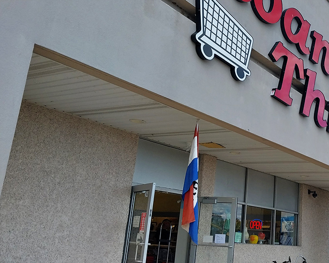 The iconic red signage of Sloan's Thrift stands as a beacon of bargain hope in Bristol, complete with that charming shopping cart logo that promises treasure hunting adventures.