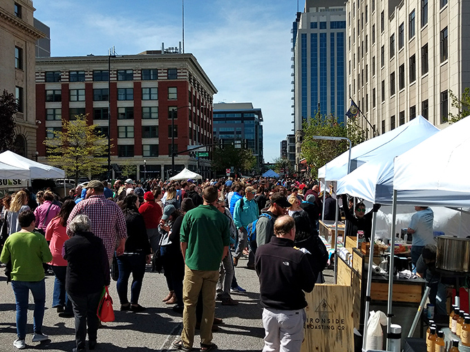 Downtown Boise transforms into a vibrant community tapestry every Saturday, where white tents line the streets and strangers become friends over shared discoveries.