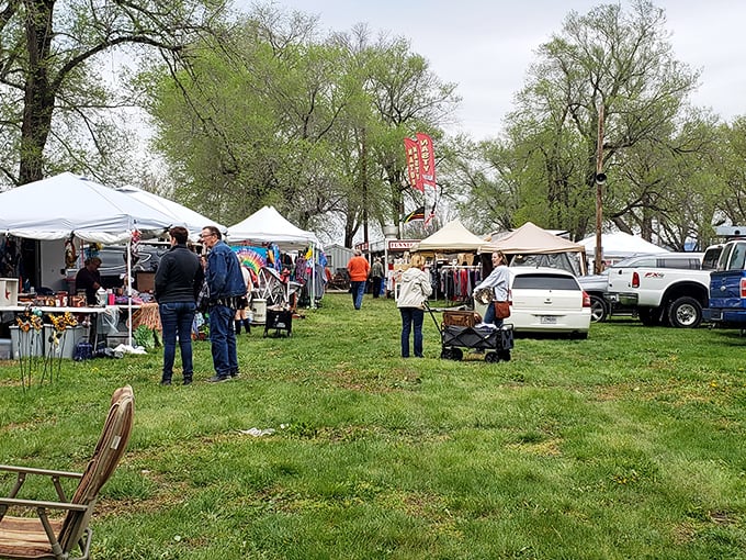 An aerial view reveals Sparks Flea Market's true scale&mdash;a sprawling treasure hunter's paradise nestled among Kansas farmland, where parking lots fill with hopeful bargain seekers.