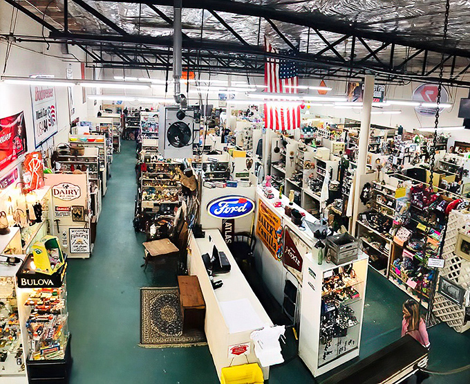 A treasure hunter's paradise stretches before you, with American flags hanging proudly overhead and vendor booths creating a labyrinth of possibility.