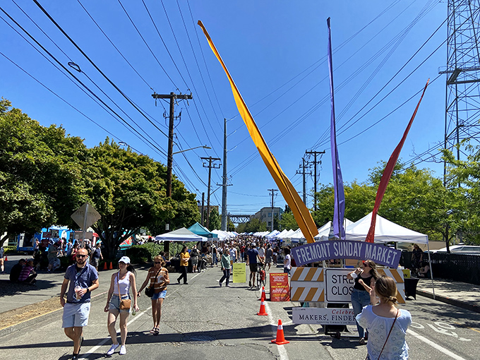 Colorful banners reach skyward, welcoming weekend treasure hunters to Seattle's ultimate urban safari. The hunt begins!