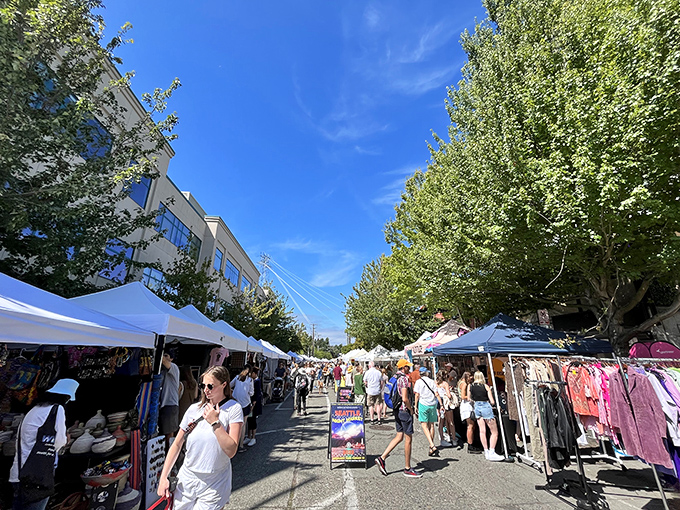 Colorful banners reach skyward, welcoming weekend treasure hunters to Seattle's ultimate urban safari. The hunt begins!