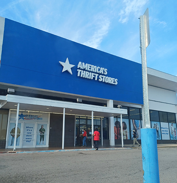 The bright blue storefront beckons like a beacon of bargain possibilities, promising treasures behind those sliding doors.