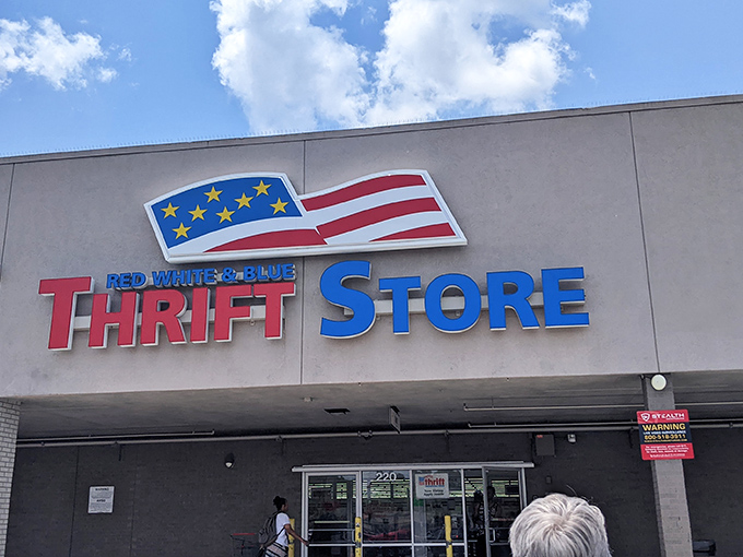 The patriotic facade of Red White and Blue Thrift Store stands proudly against the Tampa sky, a beacon for bargain hunters with its unmistakable red, white, and blue signage.