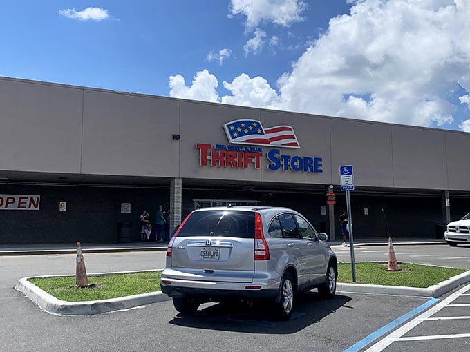 The patriotic facade of Red White and Blue Thrift Store stands proudly against the Tampa sky, a beacon for bargain hunters with its unmistakable red, white, and blue signage.