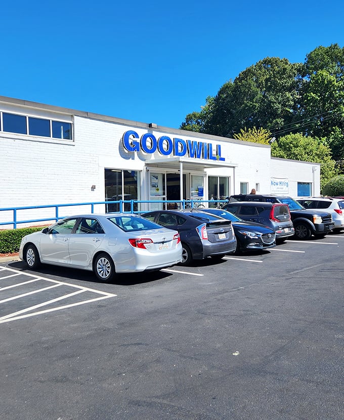 The unassuming white building with bold blue lettering promises treasure hunting adventures that fancy boutiques simply can't match.