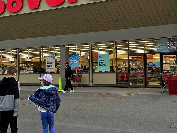 The thrill of the hunt begins at this unassuming storefront, where those iconic red carts await their destiny as treasure vessels.