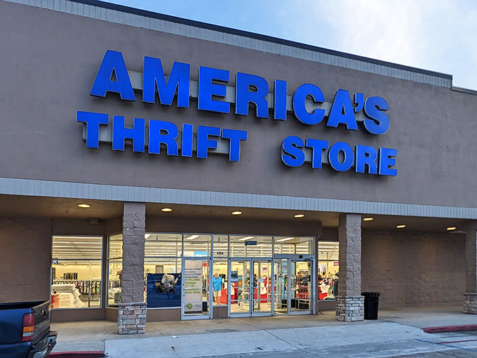 The iconic blue signage of America's Thrift Store beckons bargain hunters like a retail lighthouse guiding ships to treasure-filled shores.