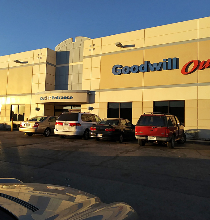 The yellow facade of Kansas City's Goodwill Outlet gleams like a beacon for bargain hunters under the clear Missouri sky.