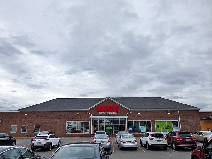 The Savers storefront at dusk, where budget dreams take flight alongside that airplane in the background. Treasure hunting season is always open here.
