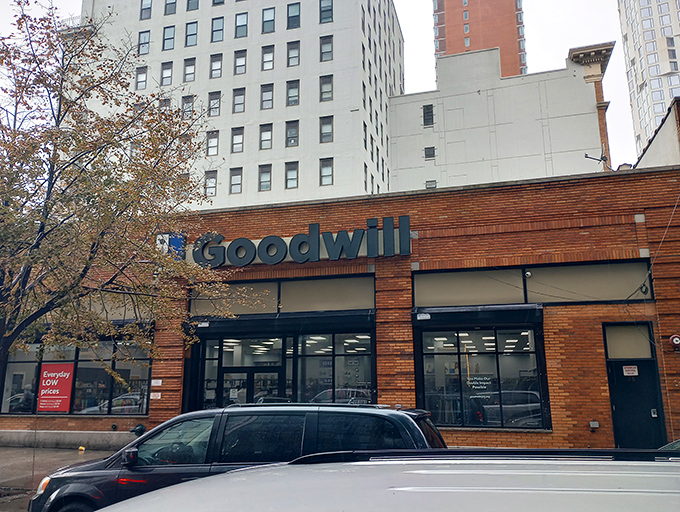 The brick facade of Brooklyn's Goodwill welcomes bargain hunters like a treasure chest waiting to be opened, promising affordable finds behind its glass doors.