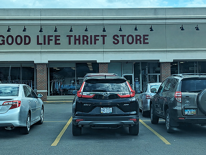 The red lettering against beige brick promises adventure within. Like a treasure map where X marks the bargain.