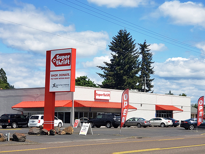 The bold red awning of SuperThrift stands out like a beacon for bargain hunters, promising treasures within its unassuming exterior.
