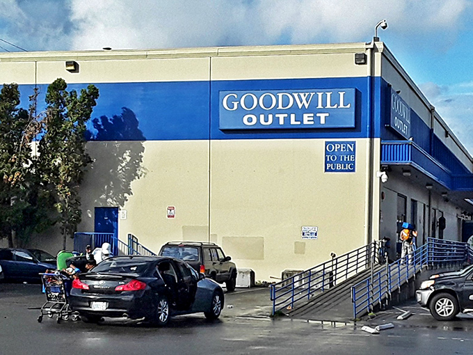 The blue-trimmed exterior of Seattle Outlet Goodwill stands like a portal to bargain dimension&mdash;where treasures await those brave enough to enter. 