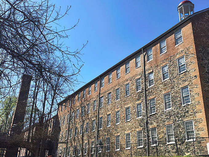 The historic brick fa&ccedil;ade of Rams Head Tavern at Savage Mill welcomes visitors with architectural charm that whispers stories from Maryland's industrial past.