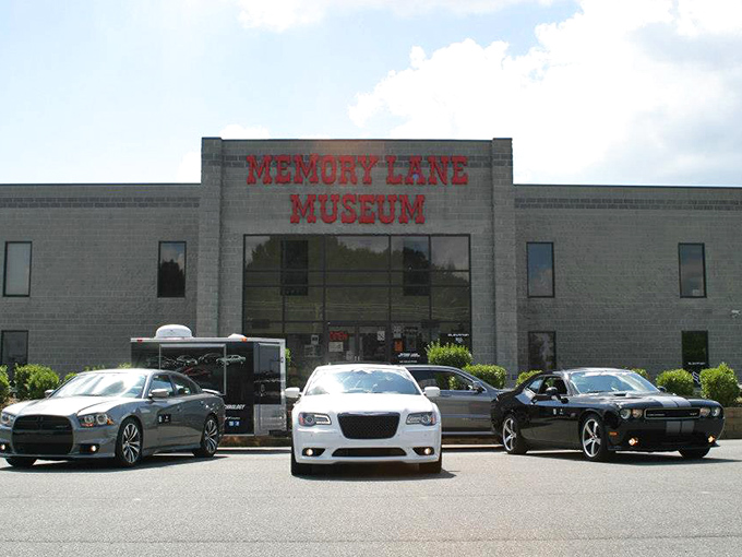 The unassuming exterior of Memory Lane Museum belies the automotive wonderland within, much like finding a V12 engine under the hood of your grandmother's station wagon.