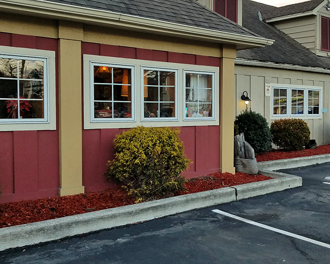 The red and white awning beckons like a lighthouse for hungry travelers. This unassuming exterior houses seafood treasures that rival coastal establishments.