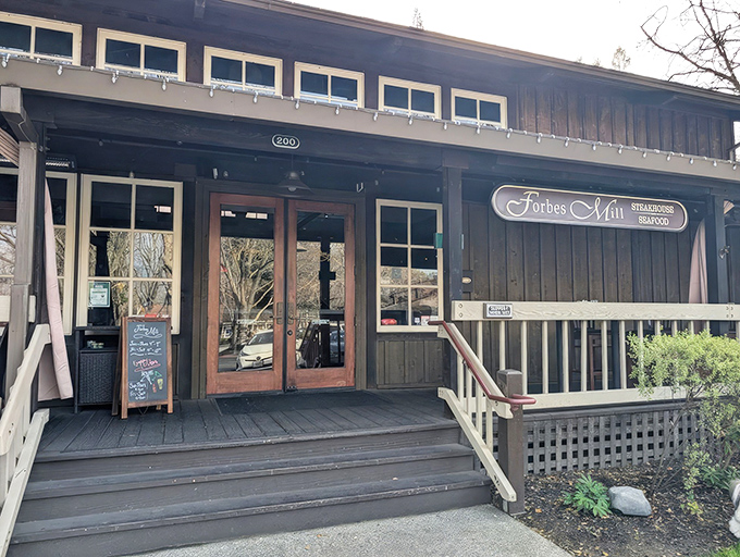 The rustic charm of Forbes Mill's exterior belies the culinary sophistication waiting inside. Those twinkling lights aren't just decoration&mdash;they're a beacon for steak lovers.