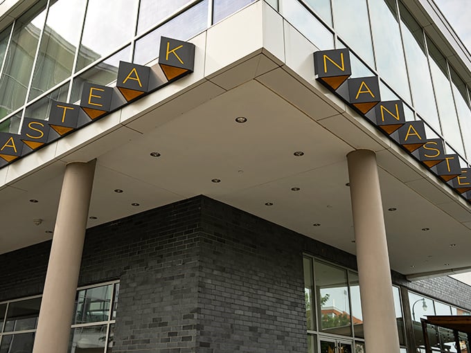 NanaSteak's illuminated sign beckons like a lighthouse for hungry souls wandering the streets of Durham, promising salvation in steak form.