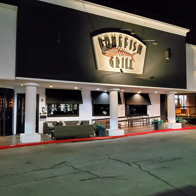 The iconic Bonefish Grill facade stands like a beacon for seafood lovers, its distinctive fish skeleton sign promising aquatic delights within.