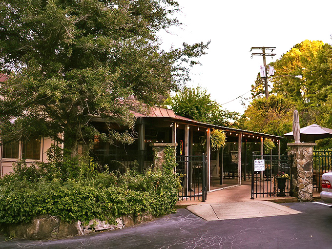Welcome to culinary paradise! The charming exterior of Red Door, with its signature red trim and inviting wooden staircase, promises delicious adventures within.