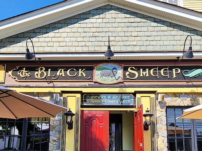 The stone facade and iconic red doors of The Black Sheep stand like a culinary lighthouse on Niantic's shore, beckoning hungry travelers with promises of exceptional fare.