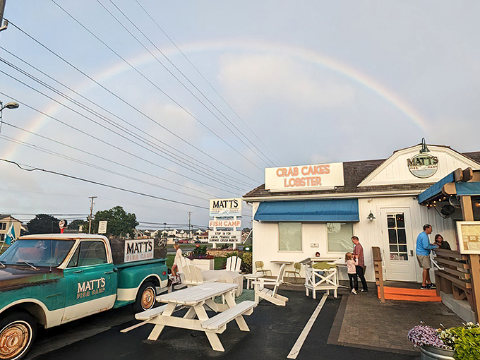 A coastal dream come true! Matt's Fish Camp's charming exterior with its blue accents, vibrant flower boxes, and inviting pergola practically whispers "come in, the seafood's fantastic."