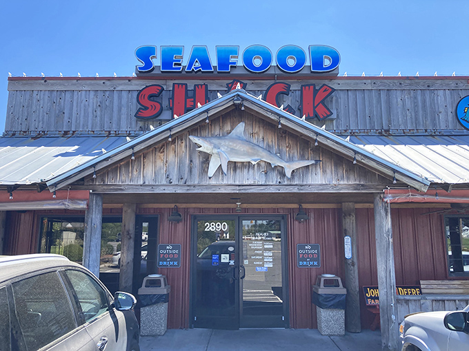 The wooden exterior of Walkertown Seafood Shack stands like a beacon of fried goodness, promising seafood treasures within those rustic walls.
