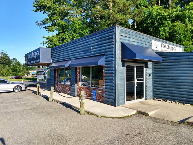 The blue wooden exterior of The Chipper stands like a portal to Britain, promising authentic beer-battered treasures within its unassuming walls.