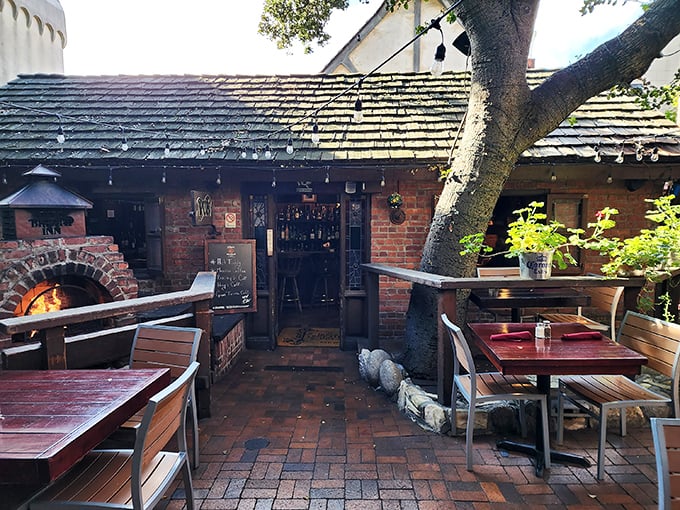 The rustic wooden exterior of Hog's Breath Inn welcomes you like an old friend, its iconic sign promising culinary adventures in the heart of charming Carmel-By-The-Sea.