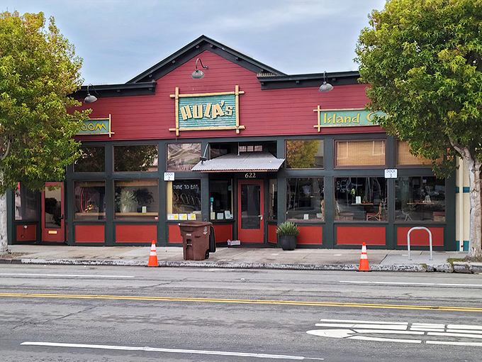 The distinctive red exterior of Hula's Island Grill stands out on Lighthouse Avenue like a tropical postcard inviting you to step inside and escape to island time.