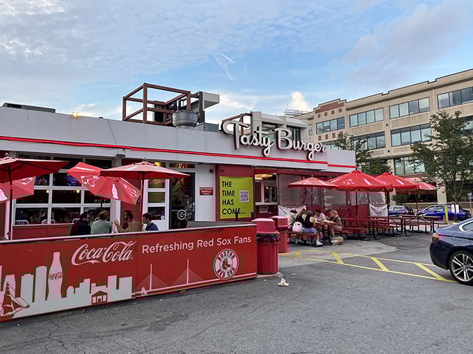 The neon glow of Tasty Burger's sign against the twilight sky beckons like a lighthouse for the hungry and flavor-deprived. Boston's answer to late-night cravings.