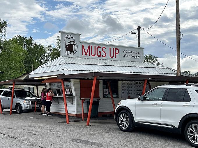 The humble white building with its distinctive orange-red supports stands like a time capsule of American drive-in culture. Simple perfection awaits.