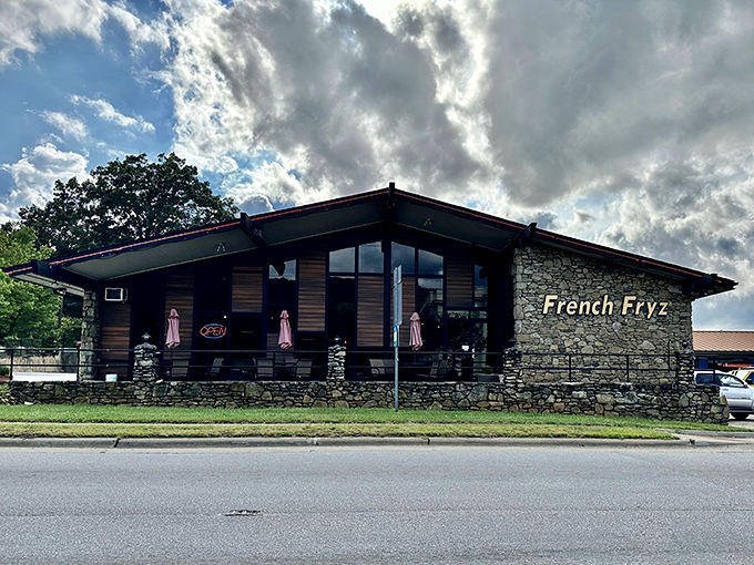 Stone and wood come together in this architectural handshake, where the American flag waves a patriotic hello to hungry visitors.