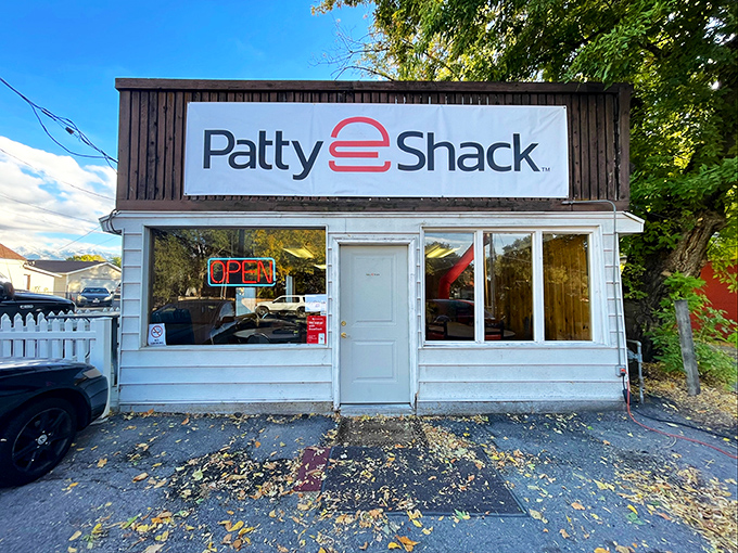 The classic white exterior with that vintage sign promises no-frills perfection. That red Thunderbird knows what's up. 