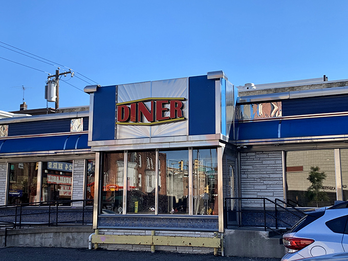 The iconic blue exterior of Broad Street Diner stands as a beacon of breakfast hope on Philadelphia's busy thoroughfare. Classic Americana at its finest.
